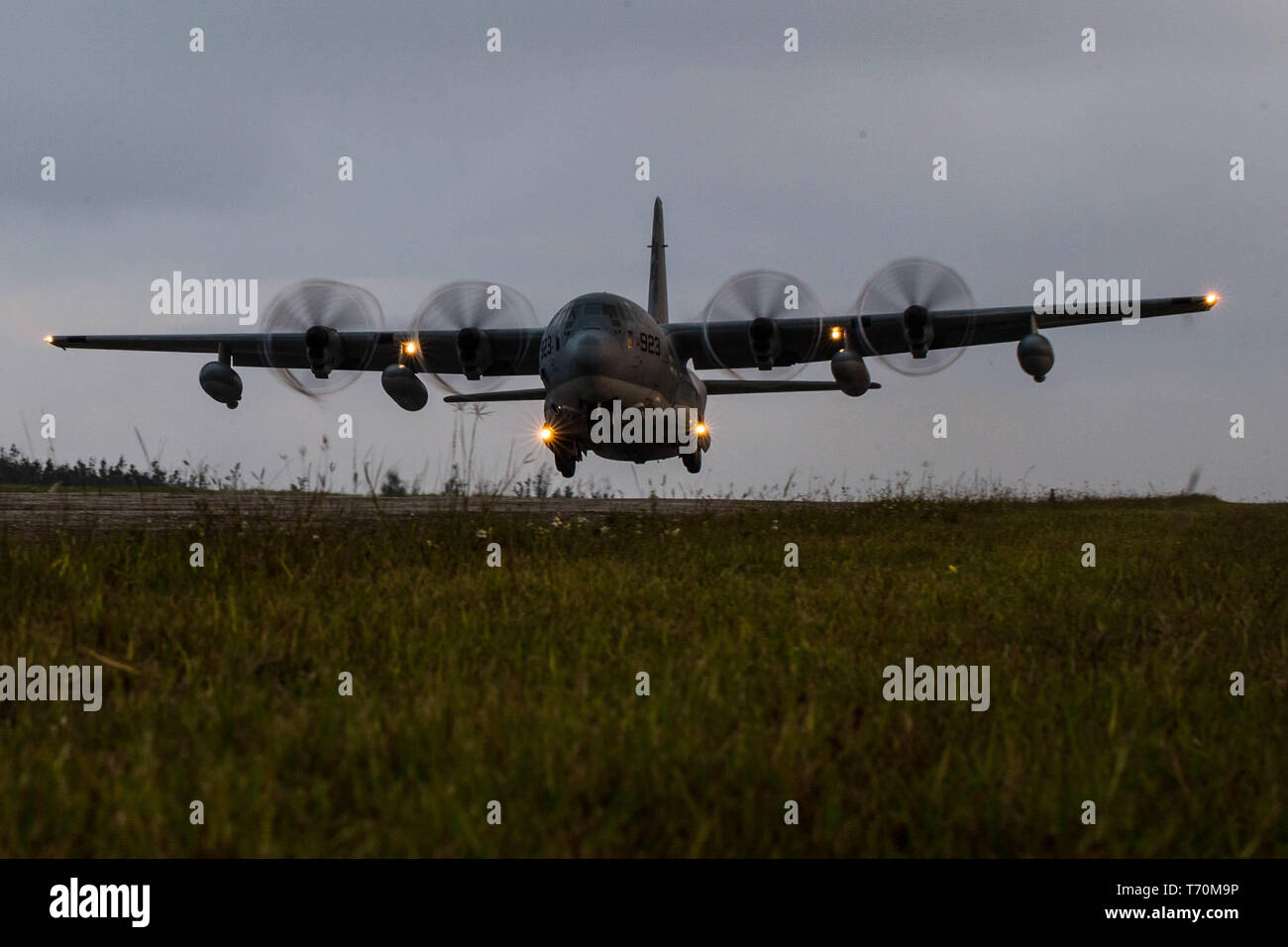 U.S. Marines with VMGR-152 support parachute riggers in air delivery ...