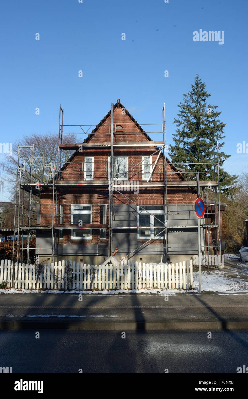 small house with scaffolding Stock Photo - Alamy