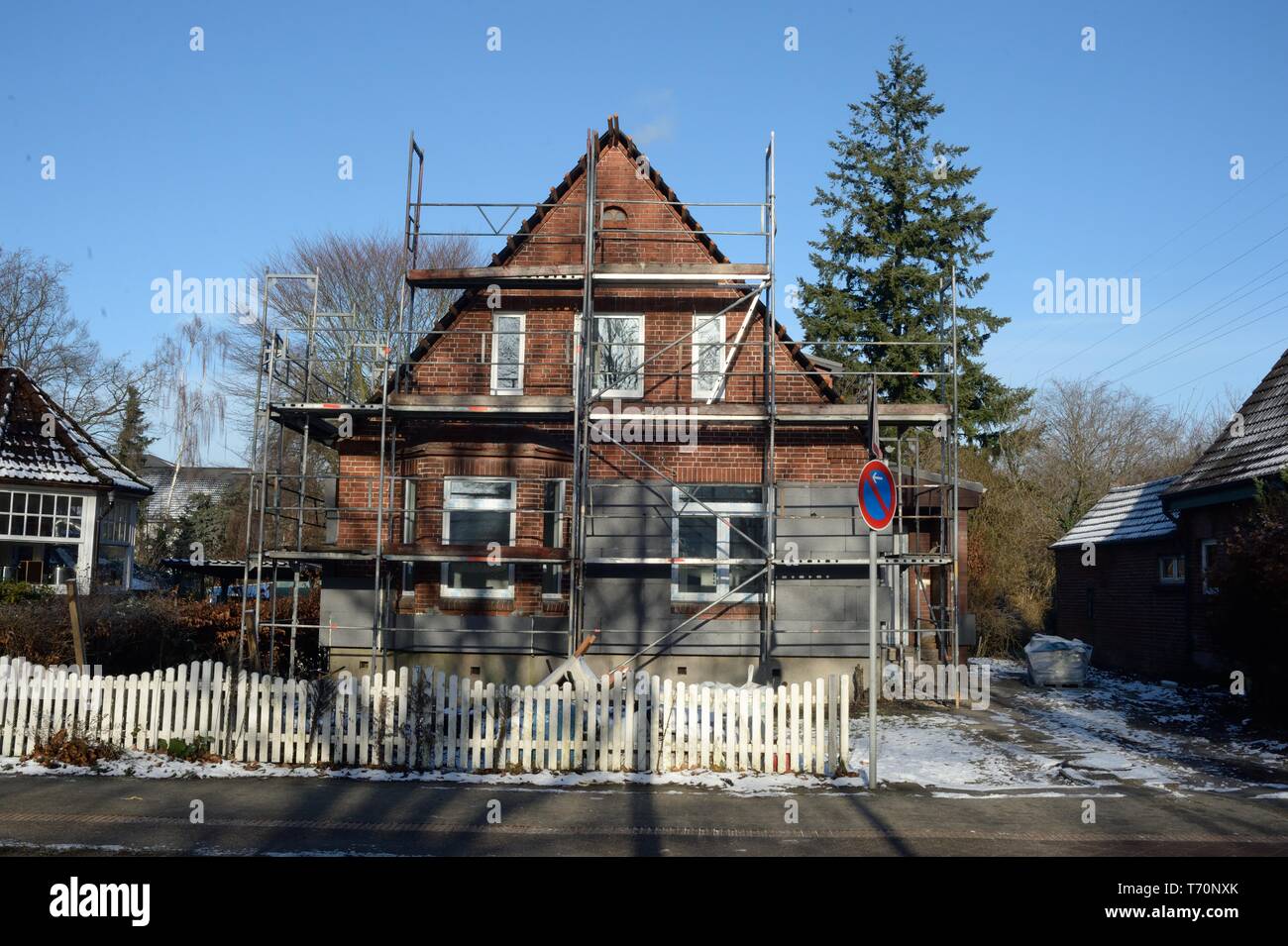 small house with scaffolding Stock Photo - Alamy