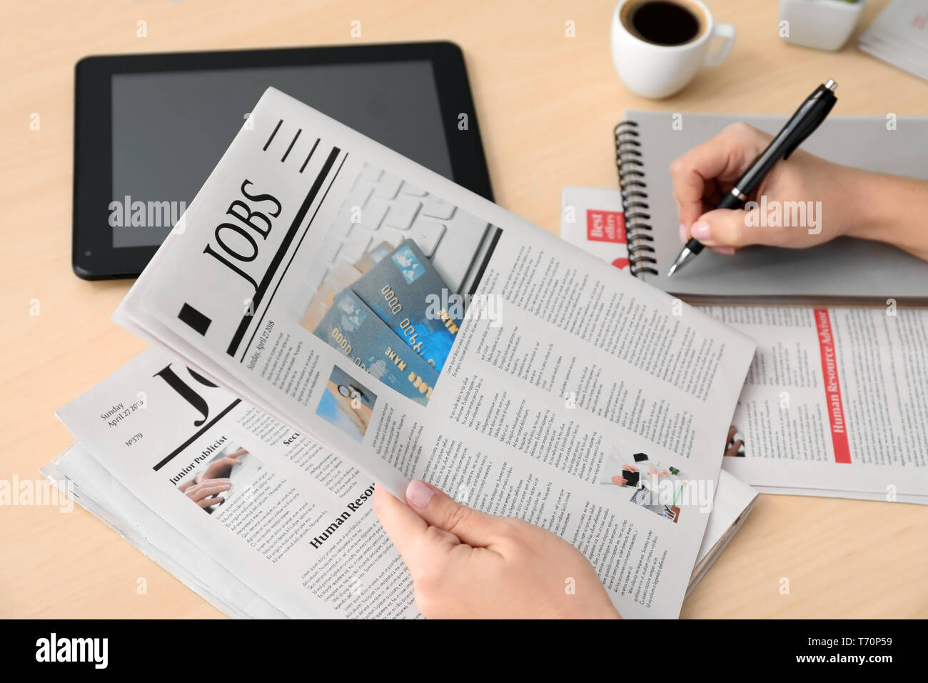 Woman looking for job newspaper hi-res stock photography and images - Alamy
