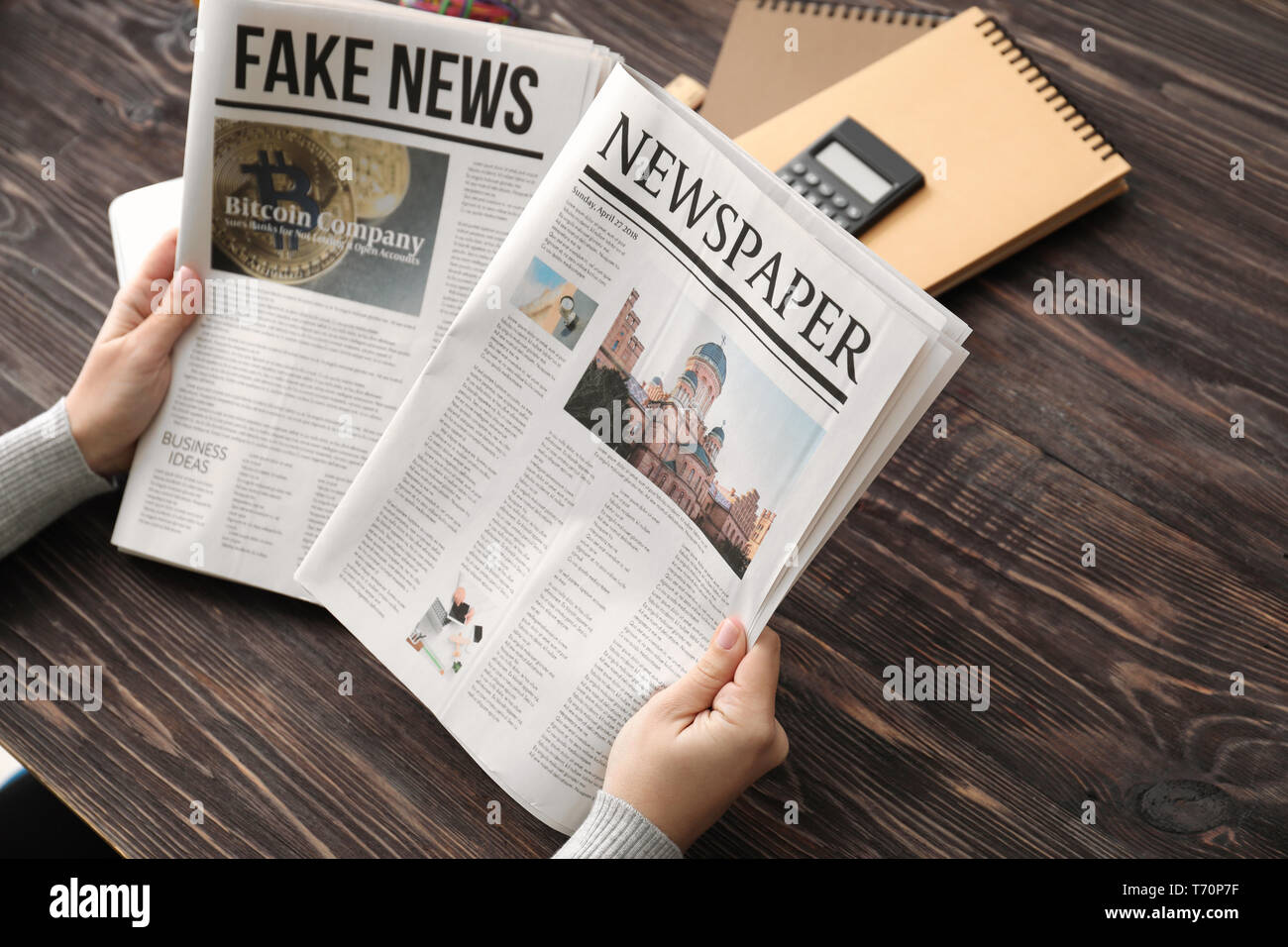 Woman sitting reading broadsheet newspaper hi-res stock photography and ...