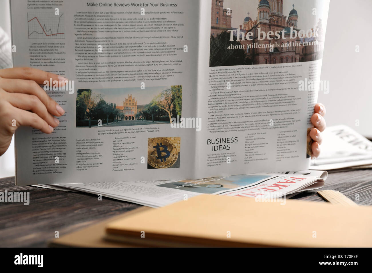 Woman sitting reading broadsheet newspaper hi-res stock photography and ...