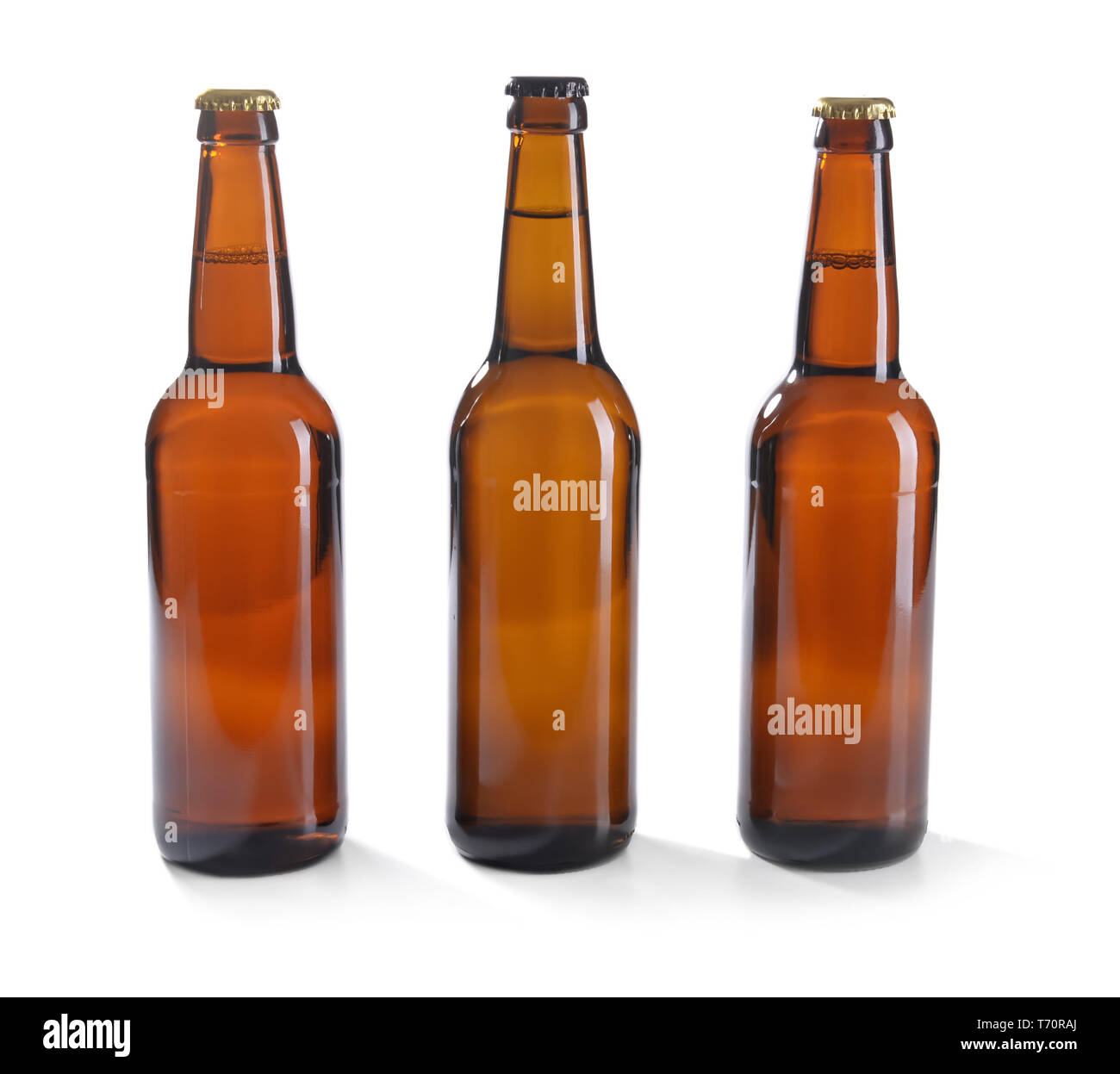 Glass bottles of beer on white background Stock Photo - Alamy