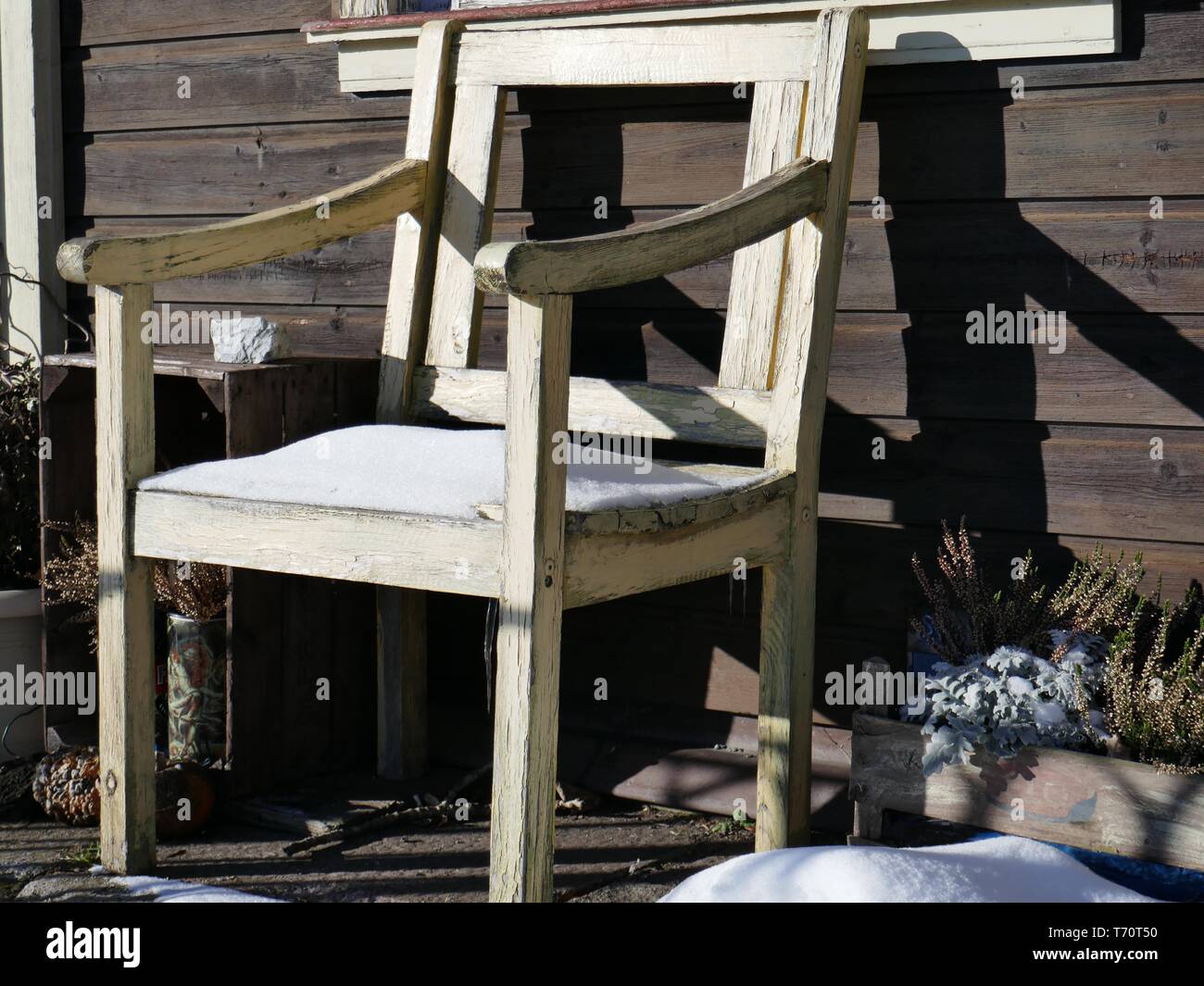 Old wood chair, outside in front of a house Stock Photo - Alamy