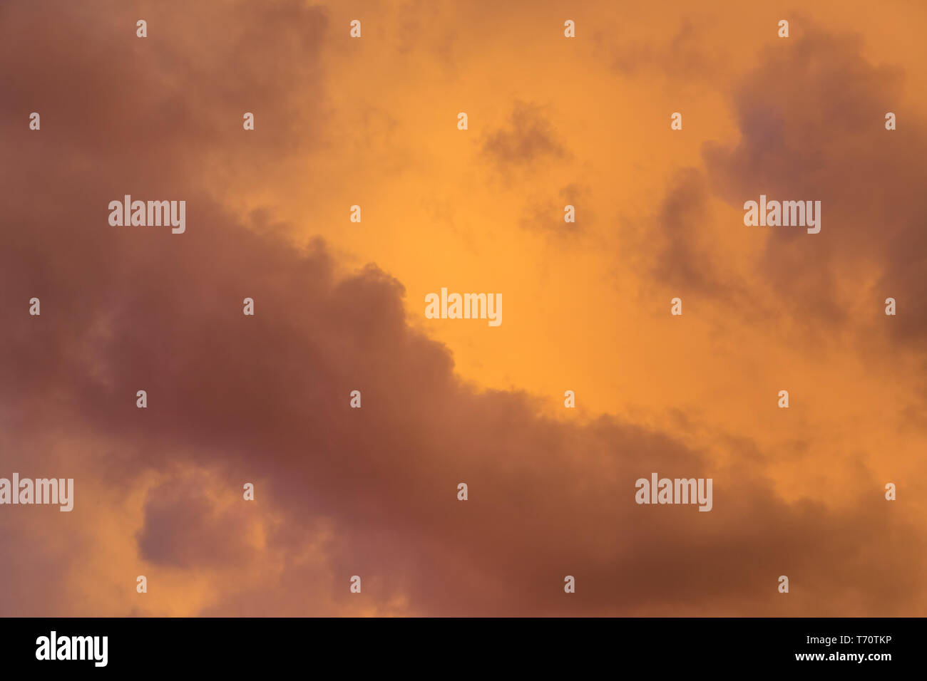 Dramatic clouds at colourful moody sunset Stock Photo - Alamy