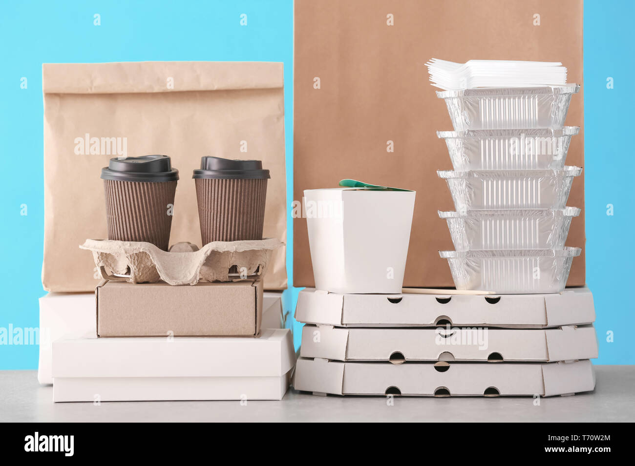 Different packages on table. Food delivery service Stock Photo - Alamy