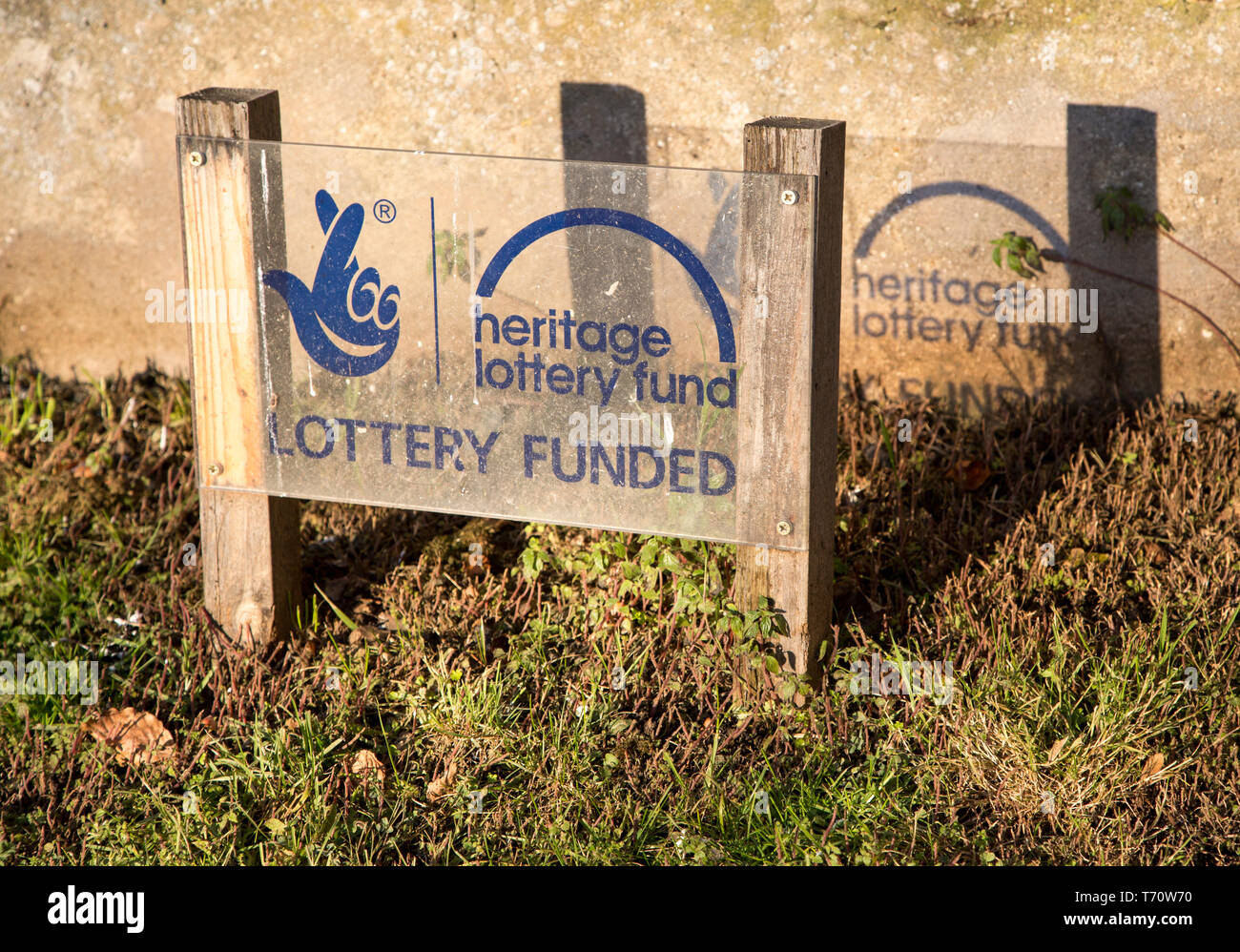 Sign in front of wall showing funding from Heritage National Lottery ...