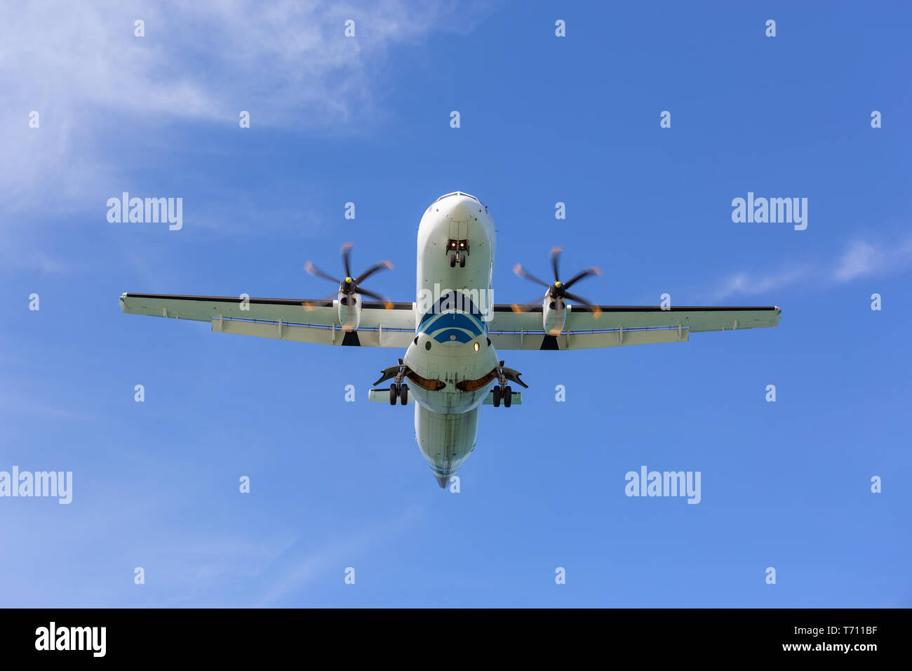 Passenger propeller airplane before landing Stock Photo - Alamy
