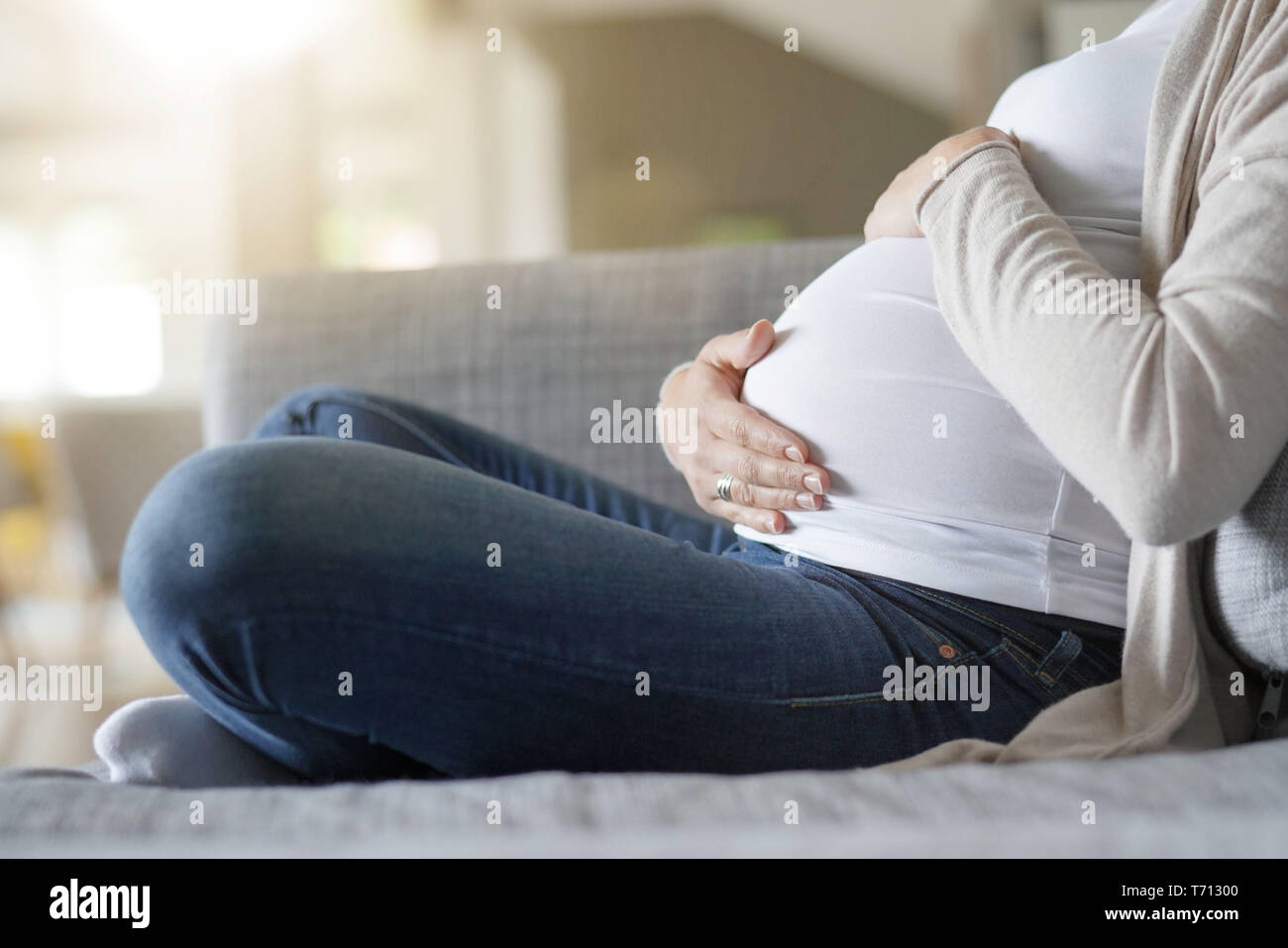 Closeup of 6-month-pregnant woman belly Stock Photo - Alamy