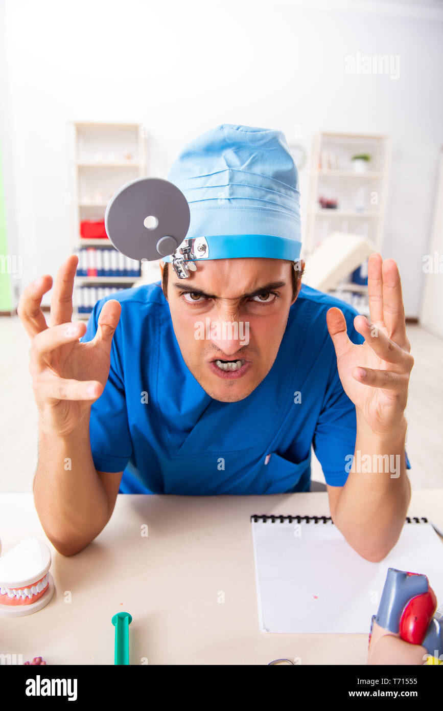 Mad doctor working in the clinic Stock Photo - Alamy