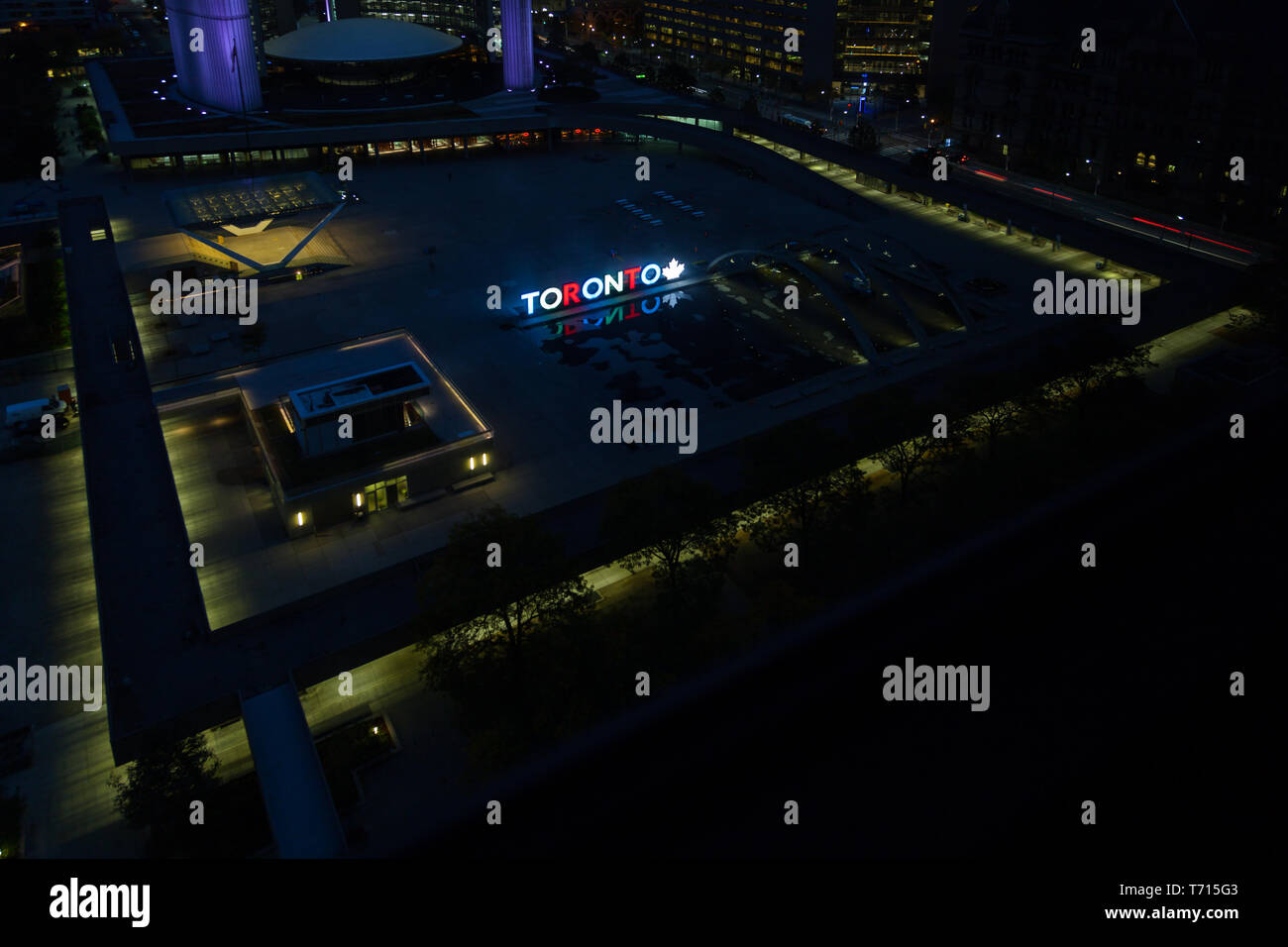 An aerial night time view across Nathan Phillips Square in Toronto ...