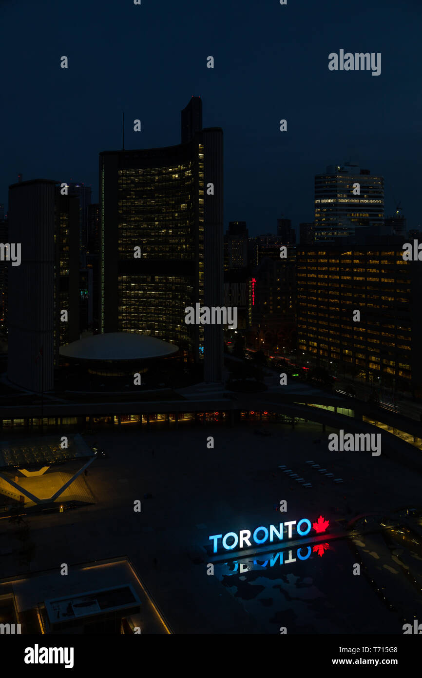 An aerial night time view across Nathan Phillips Square in Toronto ...
