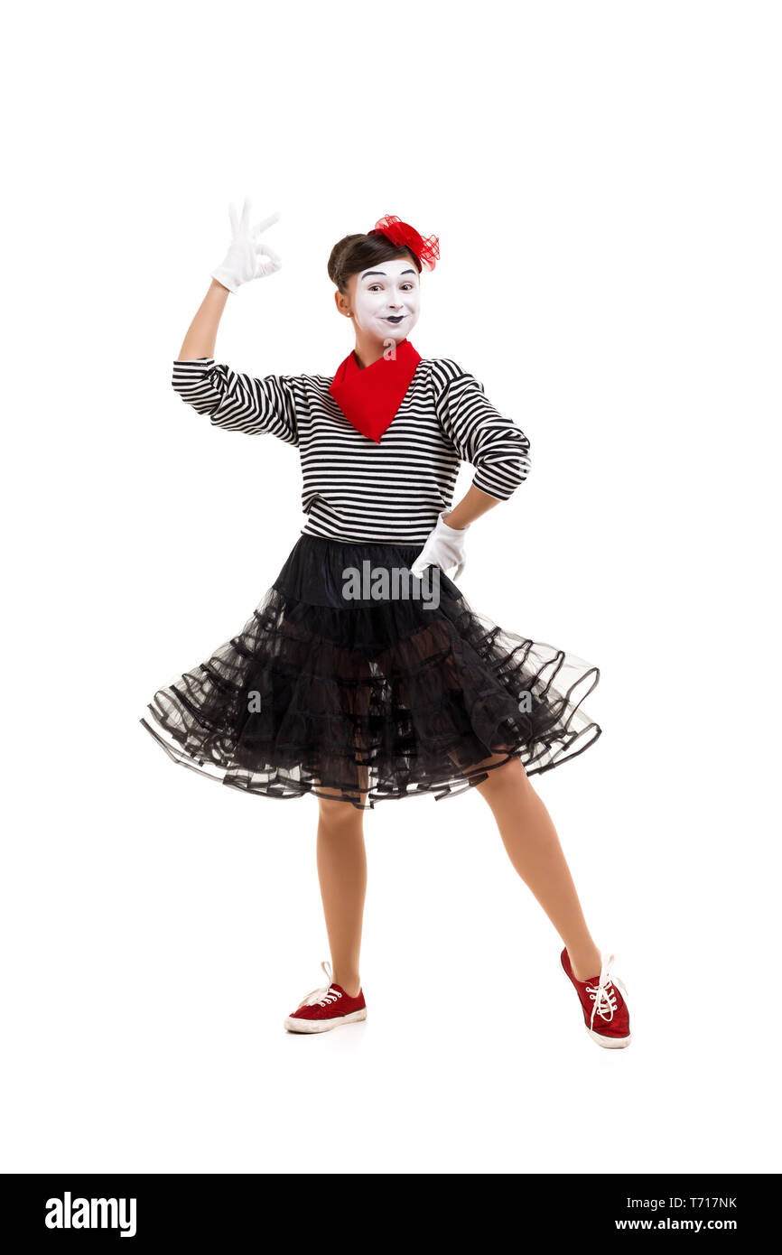 Full length portrait of a mime woman artist looking at camera and ...