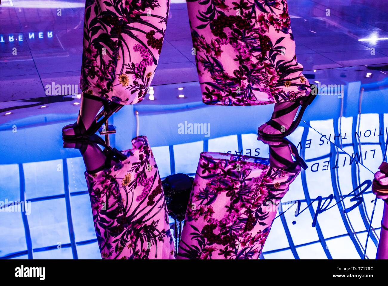 Female mannequin feet with shoes and pants, on mirror surface, fashion ...