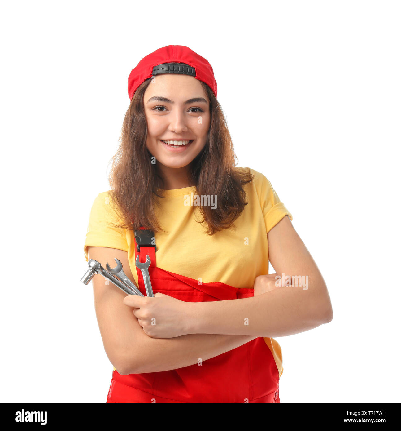 Female mechanic in uniform with instruments on white background Stock ...