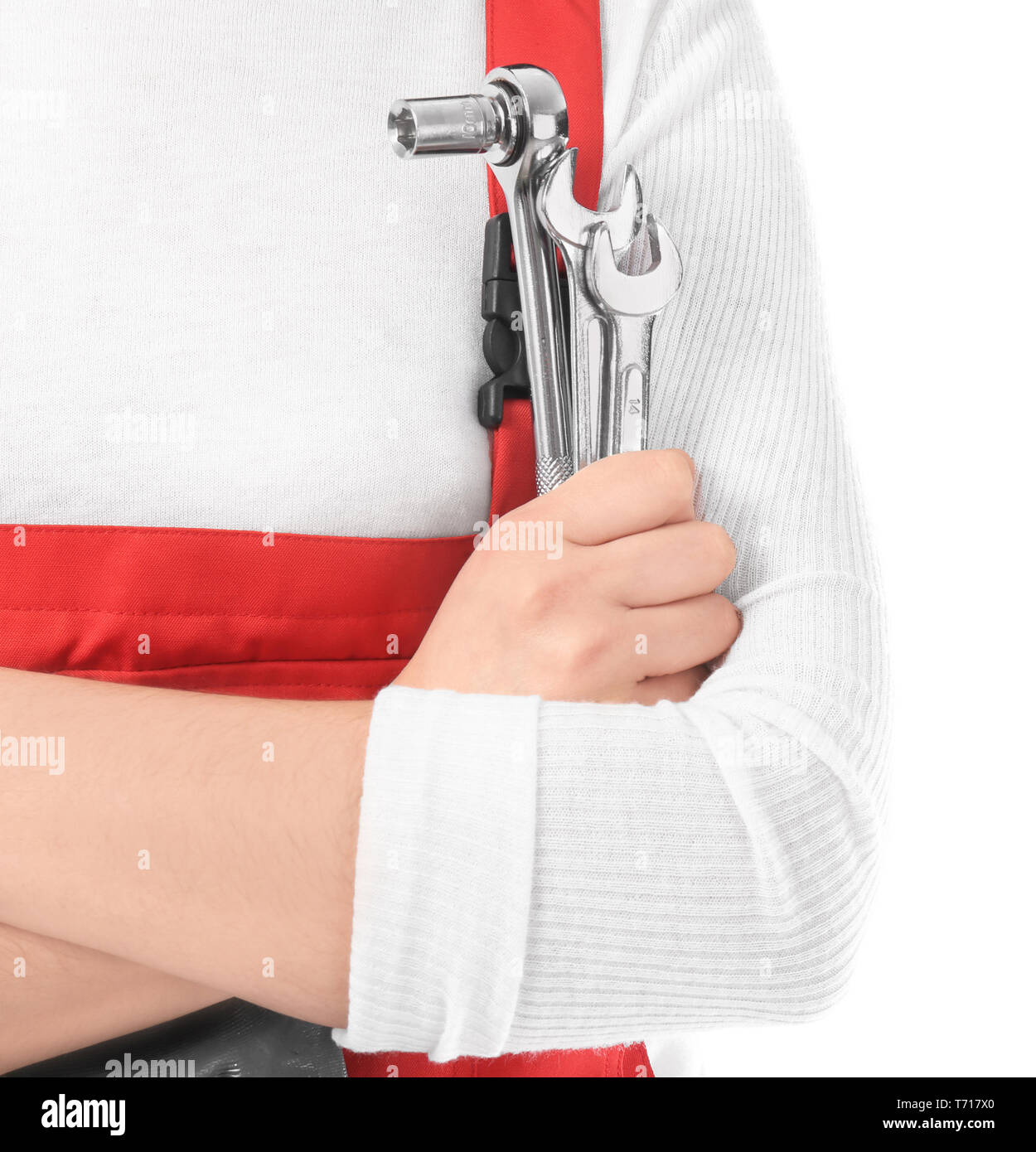 Female mechanic in uniform with instruments on white background ...