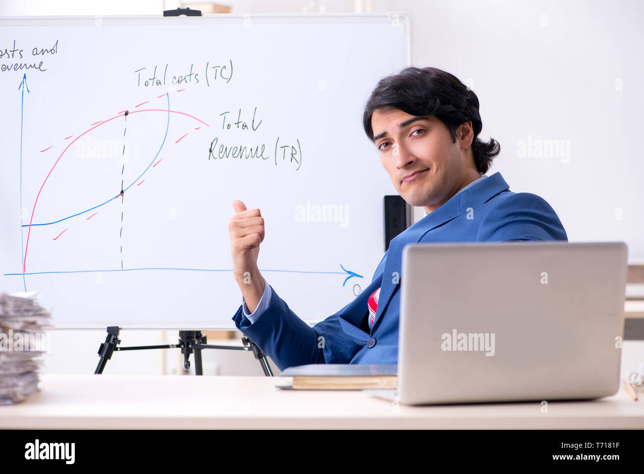 Busy businessman explaining business charts Stock Photo - Alamy