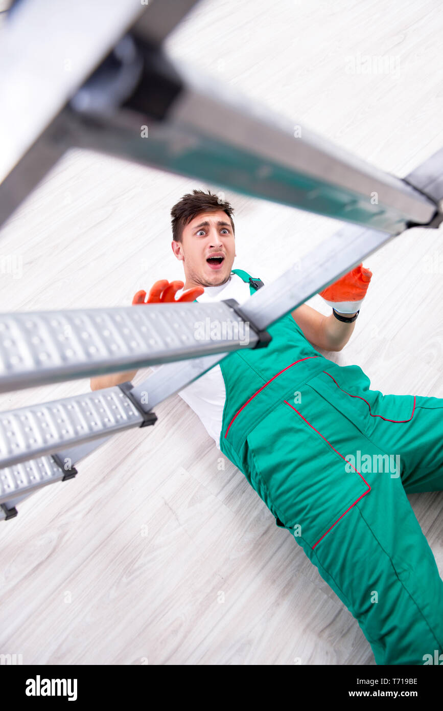 Young worker falling from the ladder Stock Photo - Alamy