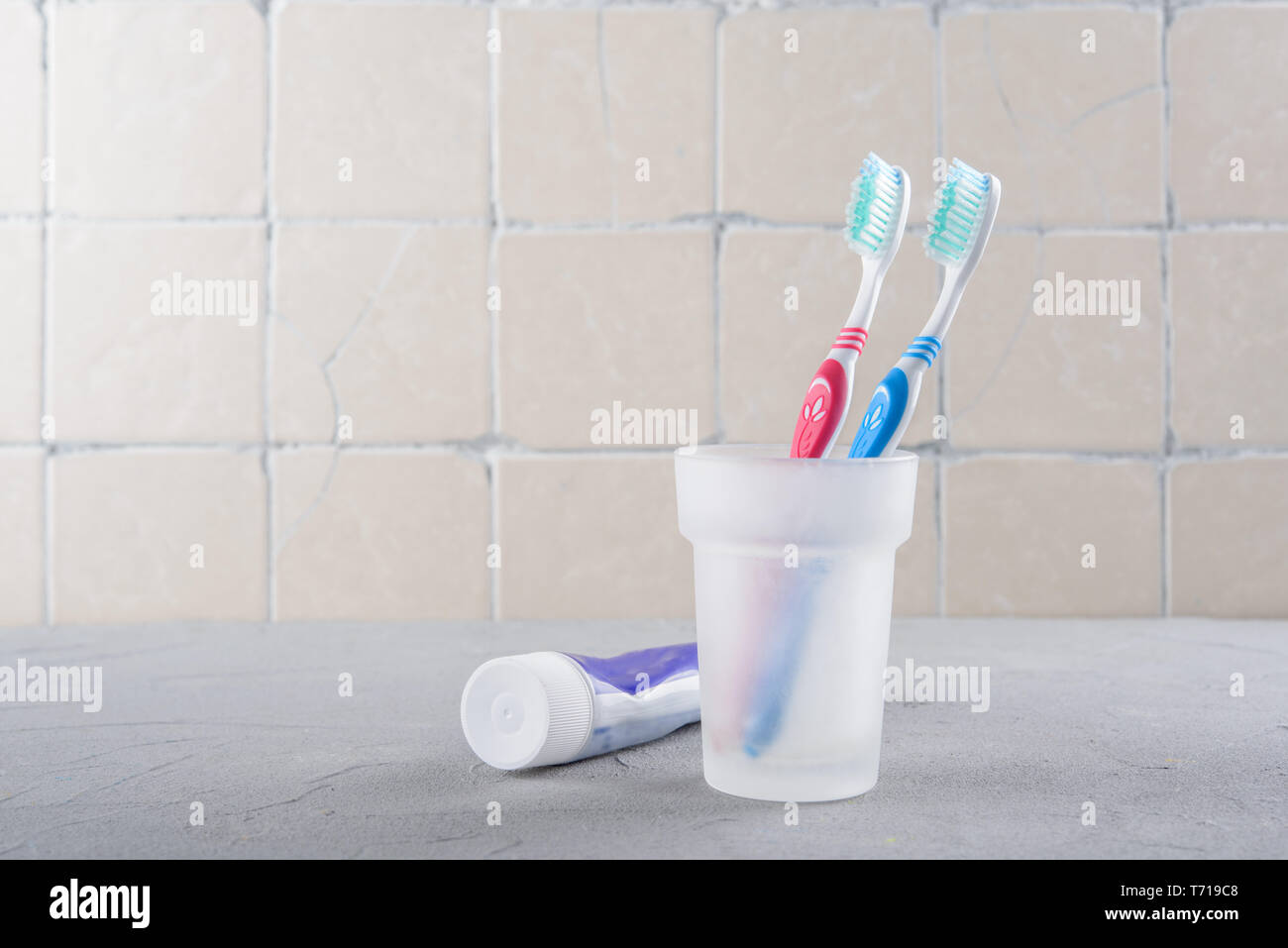 Toothbrush and toothpaste on the shelf in the bathroom Stock Photo - Alamy