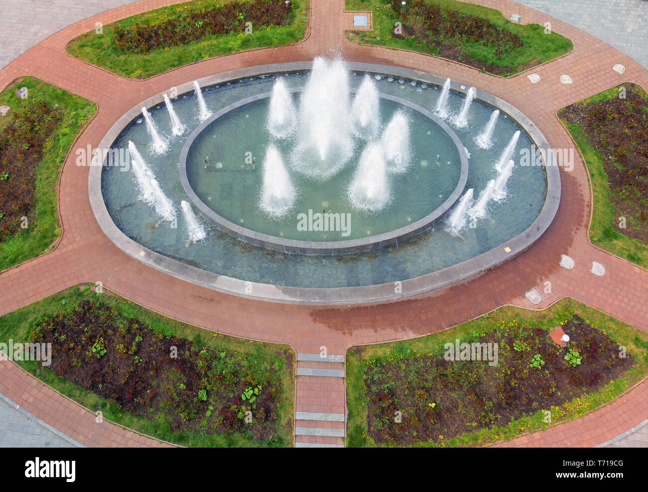 Beautiful fountain with clear blue water - top view Stock Photo - Alamy
