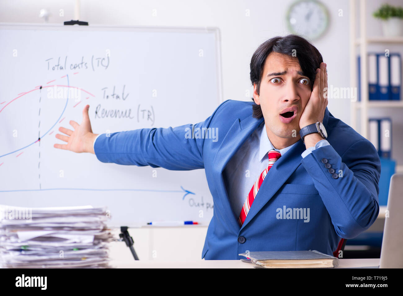 Busy businessman explaining business charts Stock Photo - Alamy