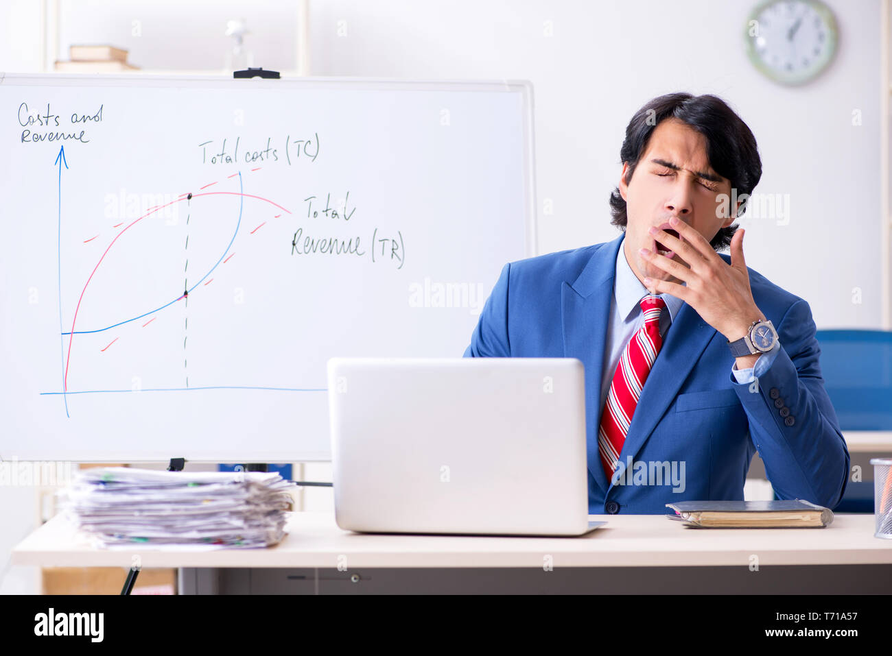 Busy businessman explaining business charts Stock Photo - Alamy