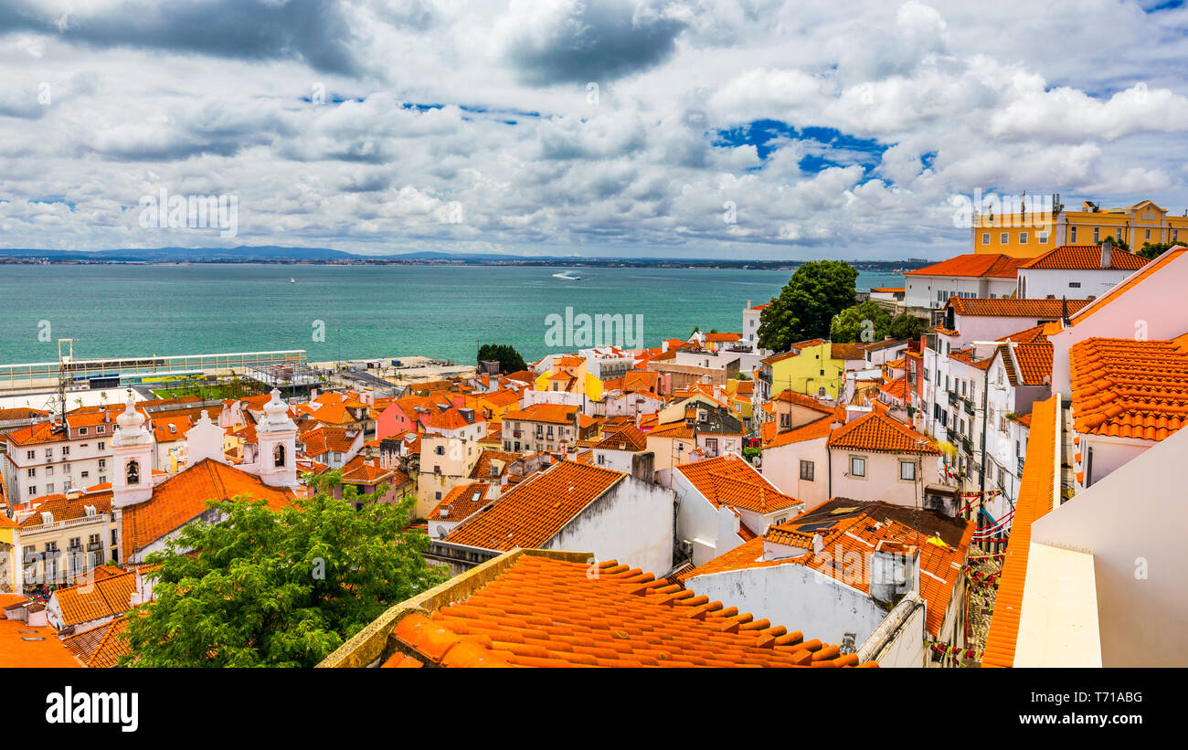 Lisbon, Portugal city skyline over the Alfama district. Summertime ...