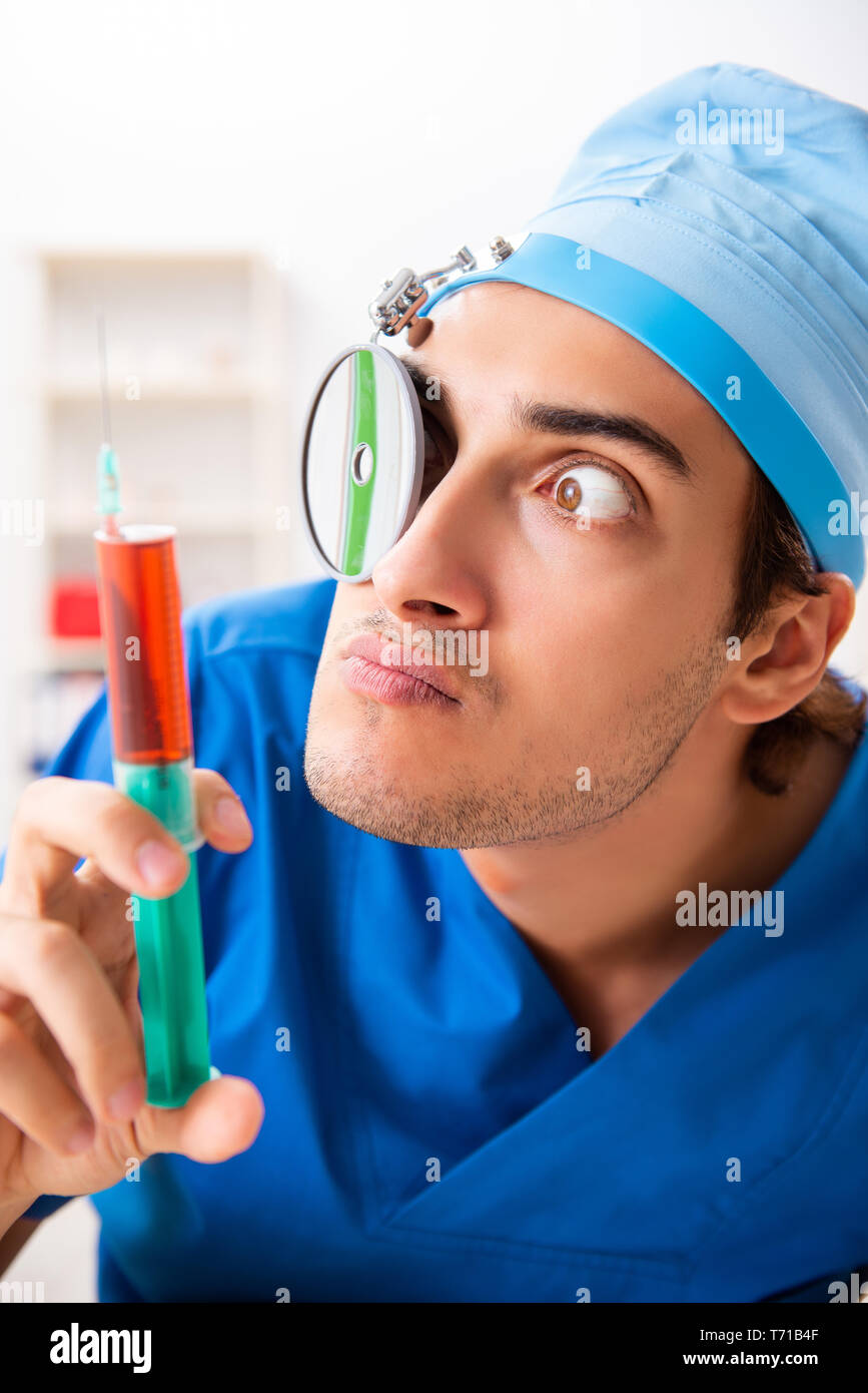 Mad doctor syringe hi-res stock photography and images - Alamy