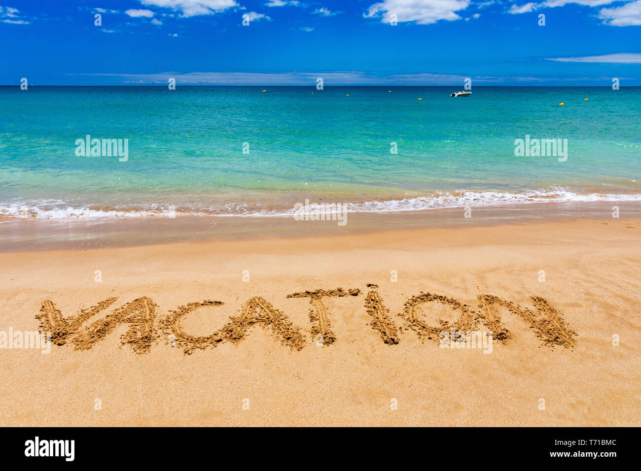 Vacation text on a beach. Vacation written in a sandy tropical beach ...
