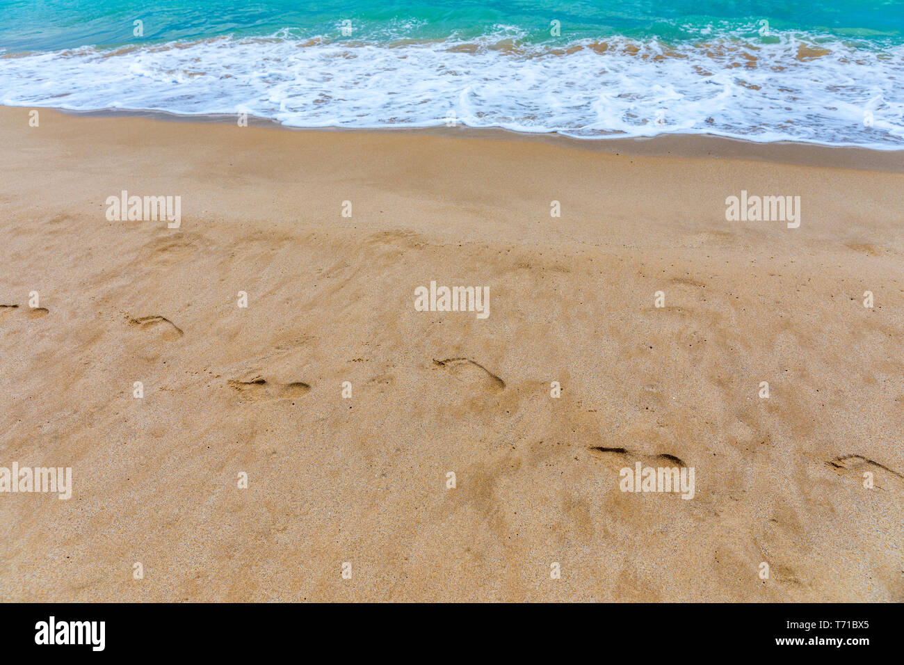 Footsteps in the sand. Footprints in the sand beach. Footprints in the ...