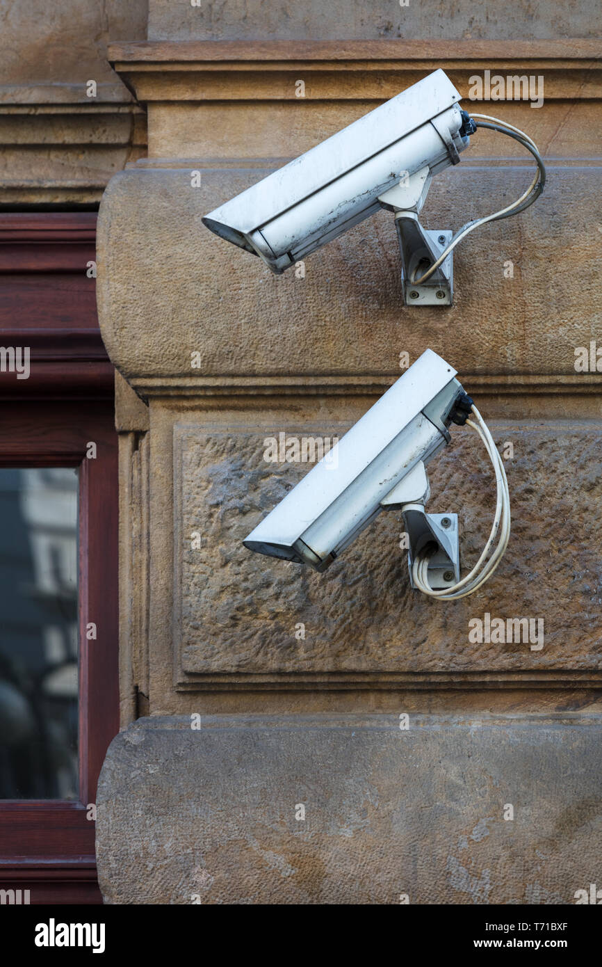 street surveillance camera on wall of the building Stock Photo - Alamy