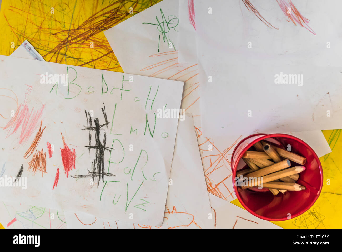 Painted sheet of paper and supplies for drawing. Top view of the child ...