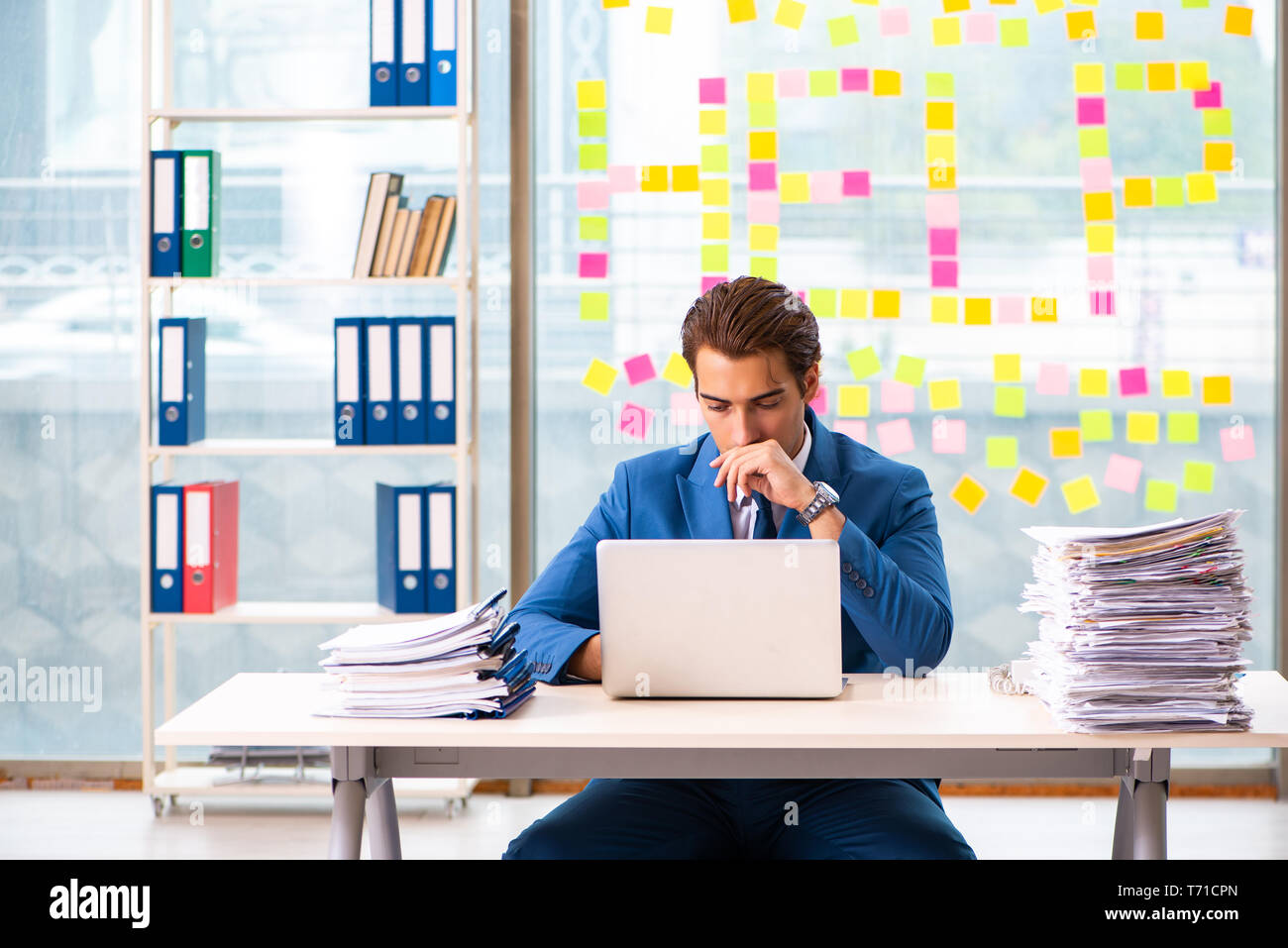 Busy businessman working in the office Stock Photo - Alamy