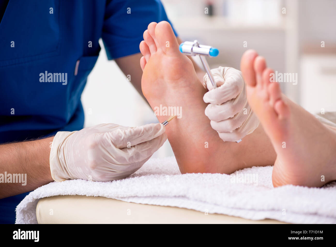 Podiatrist Examining Foot Patient High Resolution Stock Photography and ...