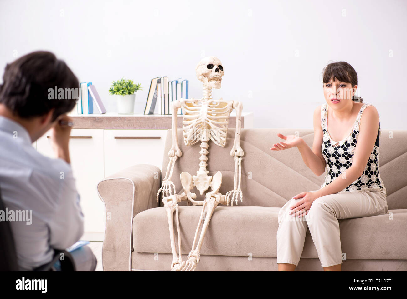 Young patient visiting psychologist for therapy Stock Photo - Alamy