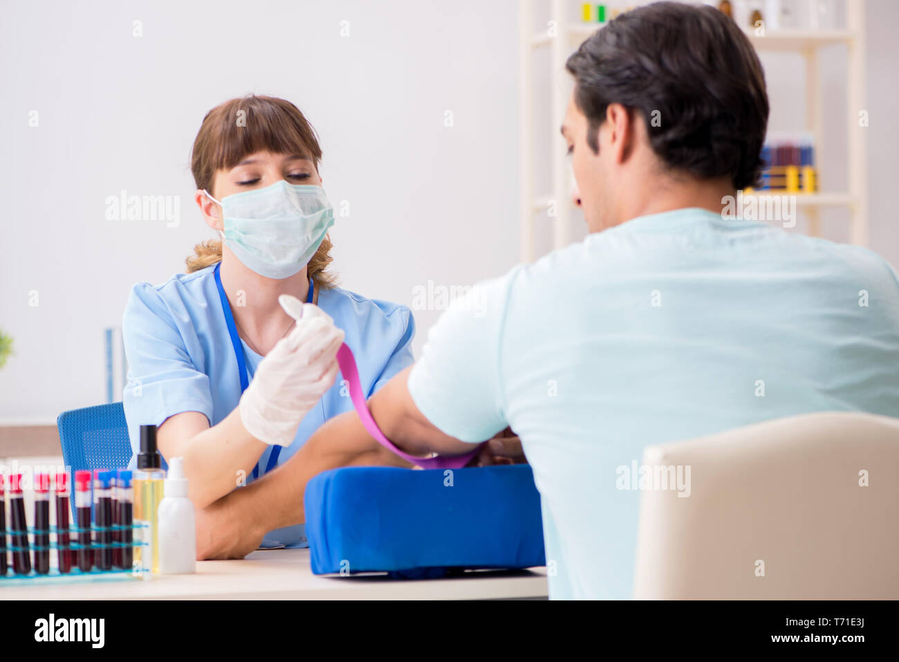 Young patient during blood test sampling procedure Stock Photo - Alamy
