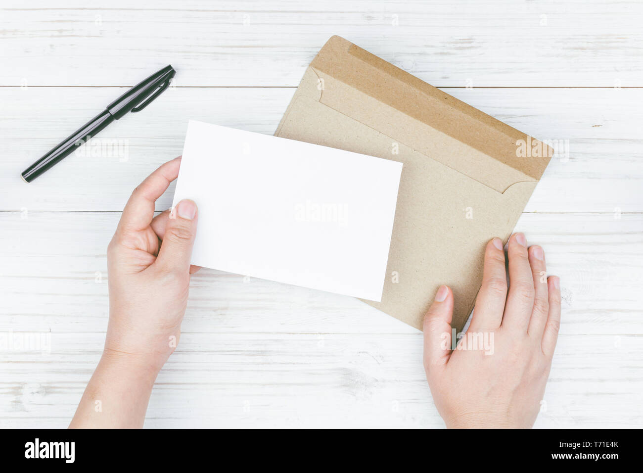 open envelope with white paper on a white background Stock Photo - Alamy