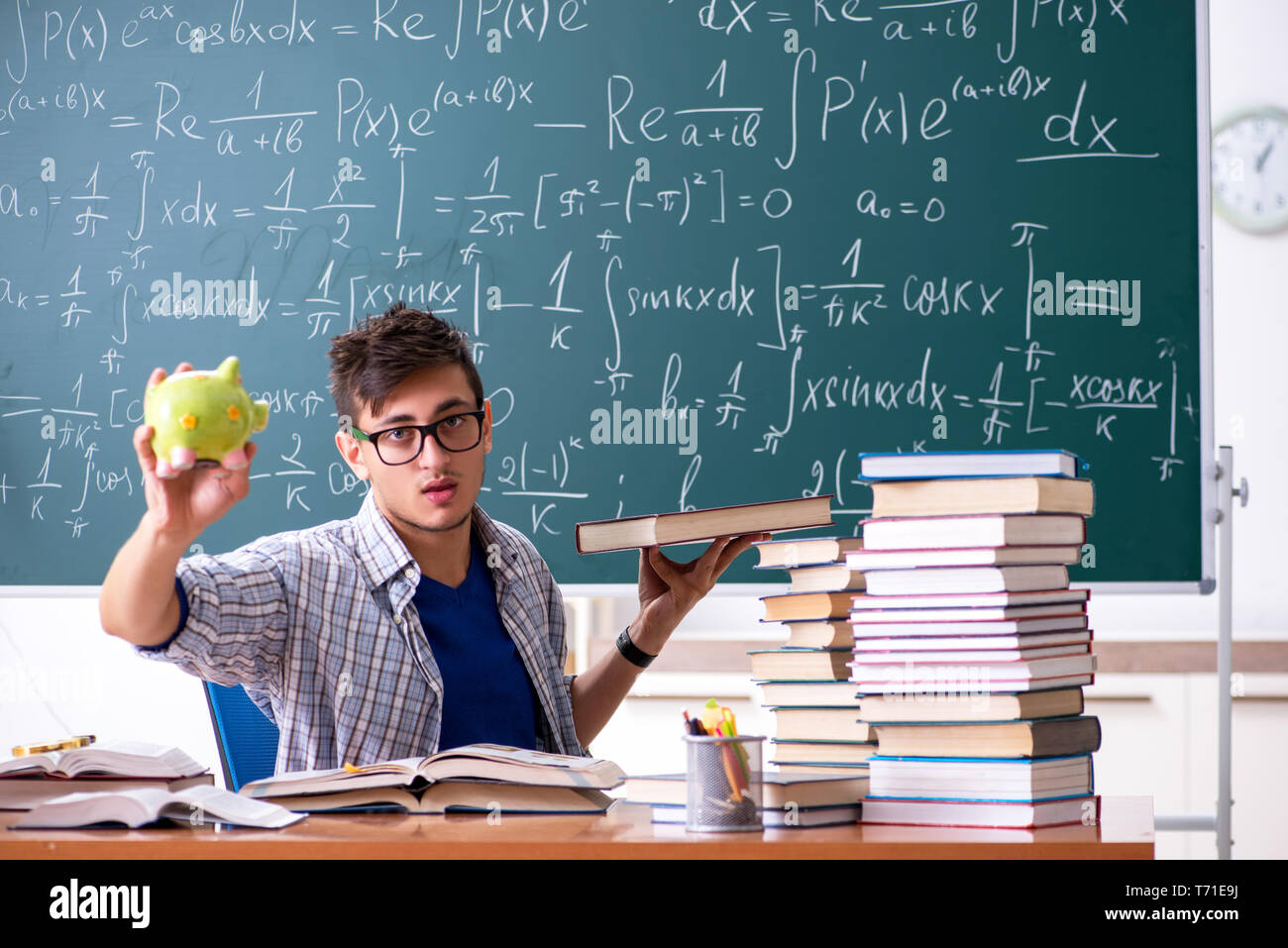 Young male student studying math at school Stock Photo - Alamy
