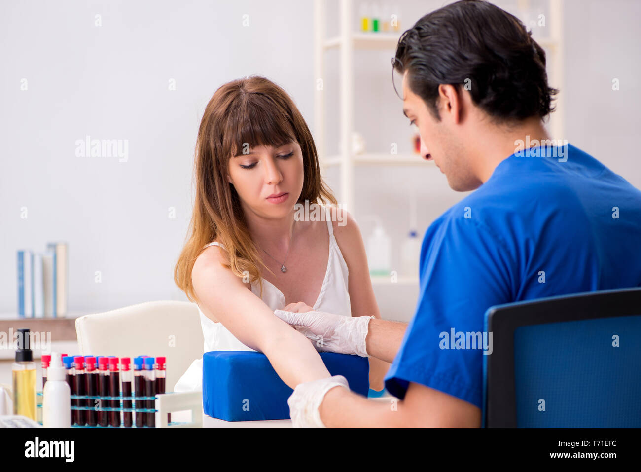 Young patient during blood test sampling procedure Stock Photo - Alamy