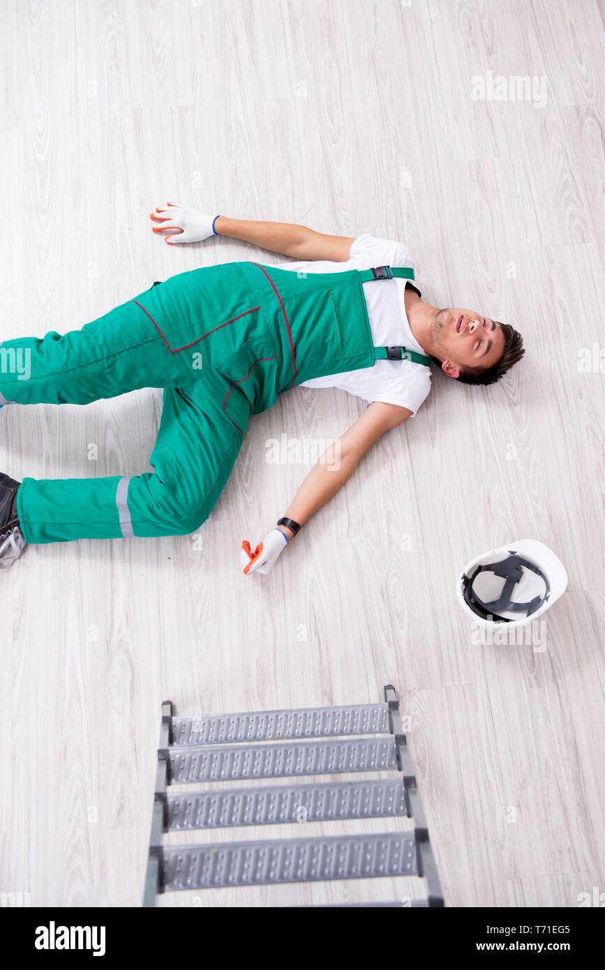 Young worker falling from the ladder Stock Photo - Alamy