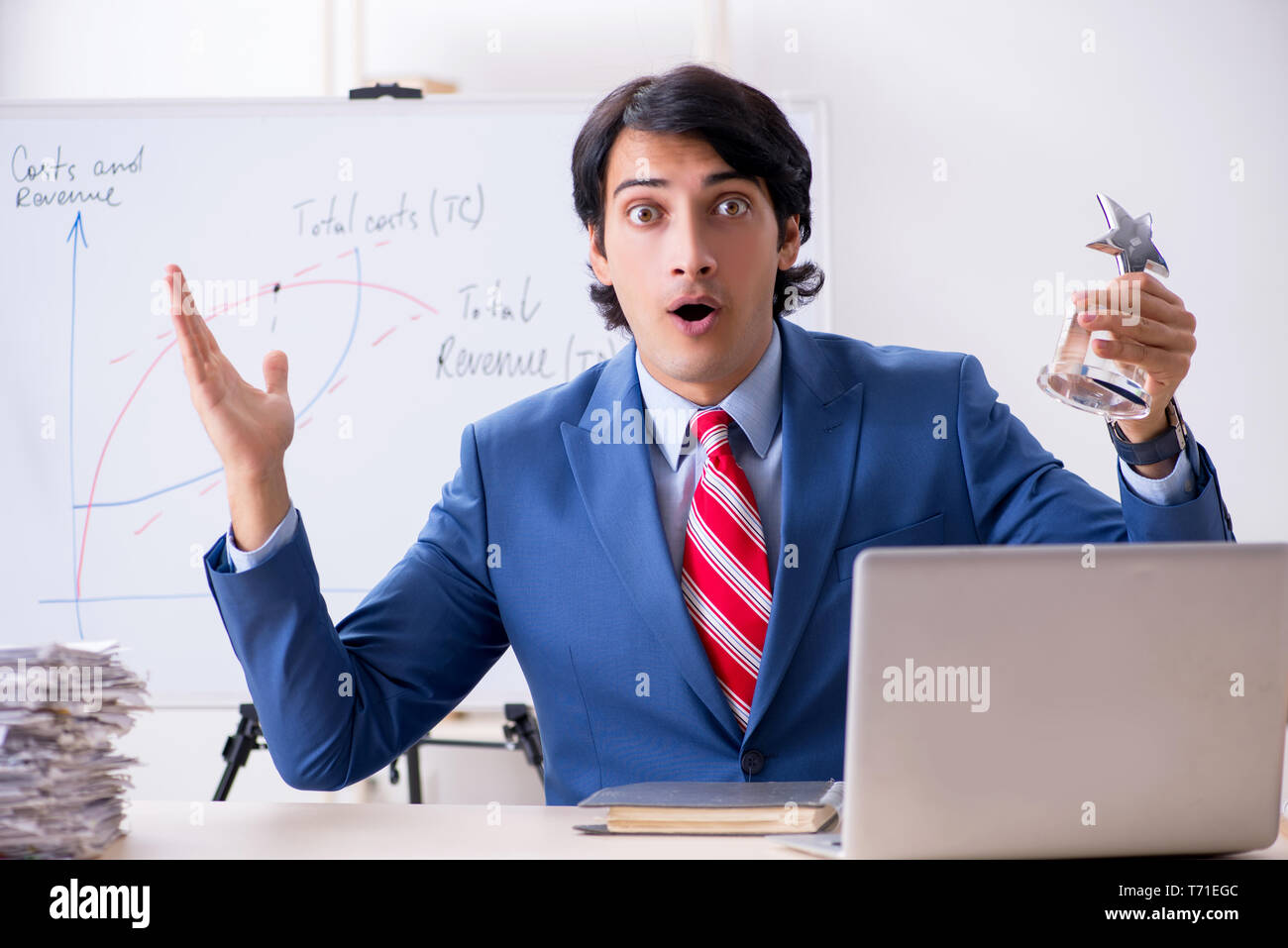 Busy businessman explaining business charts Stock Photo - Alamy