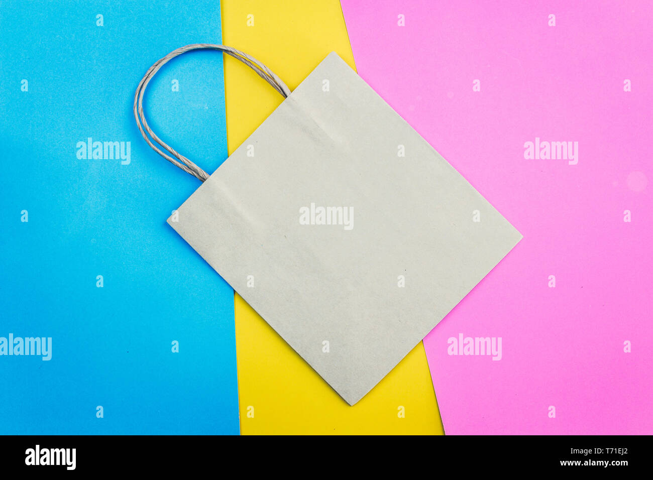 Brown paper bag on colourful background Stock Photo - Alamy