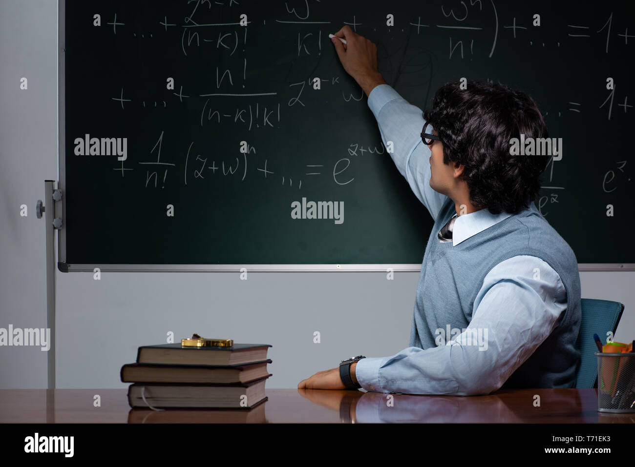 Man in front of blackboard math hi-res stock photography and images - Alamy