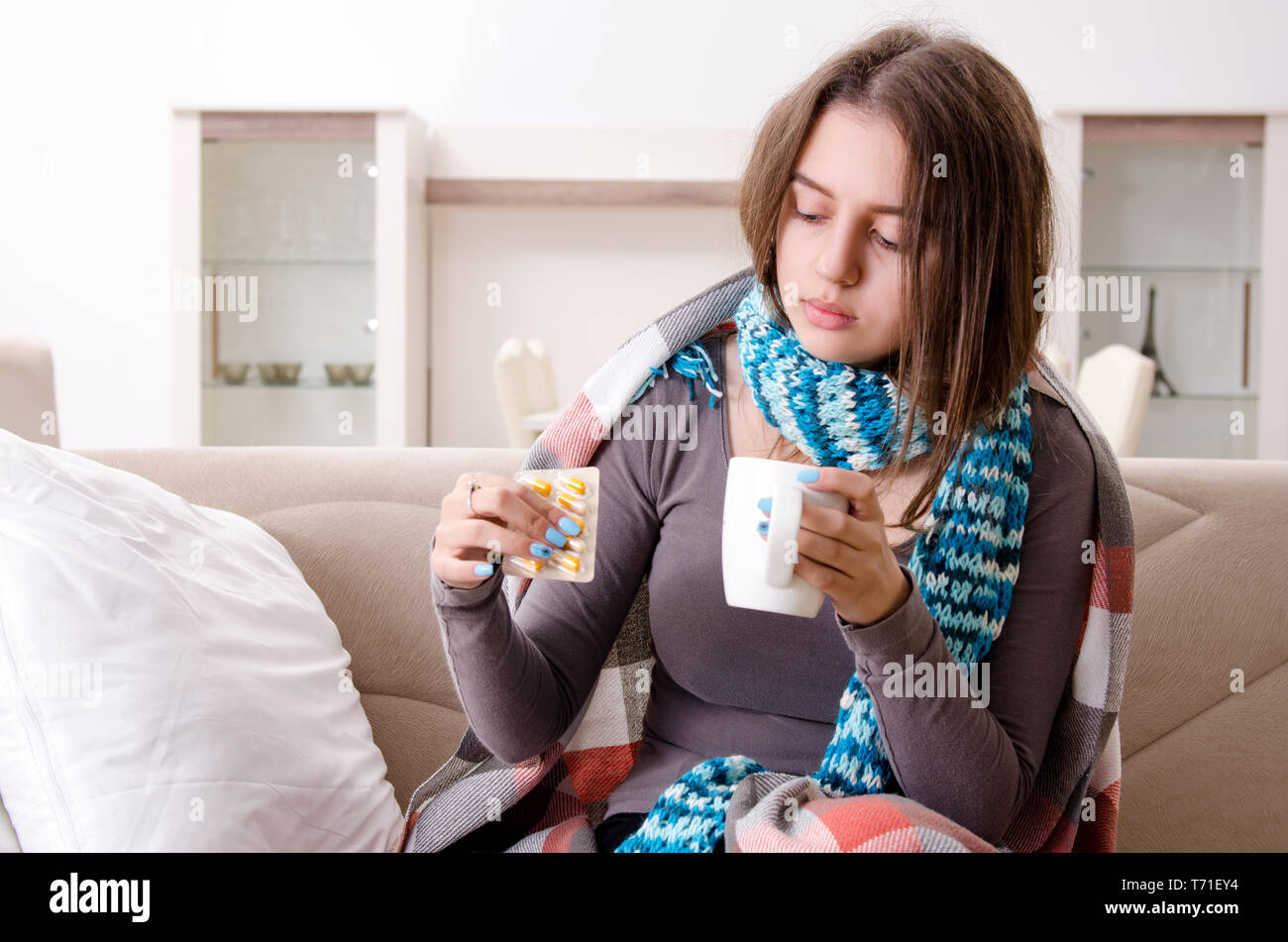 Sad sick young woman drinking hi-res stock photography and images - Alamy
