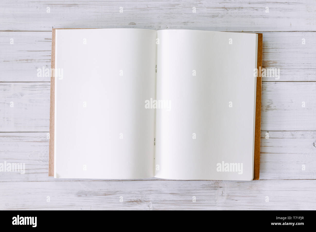 Open book with blank pages on wooden background Stock Photo - Alamy