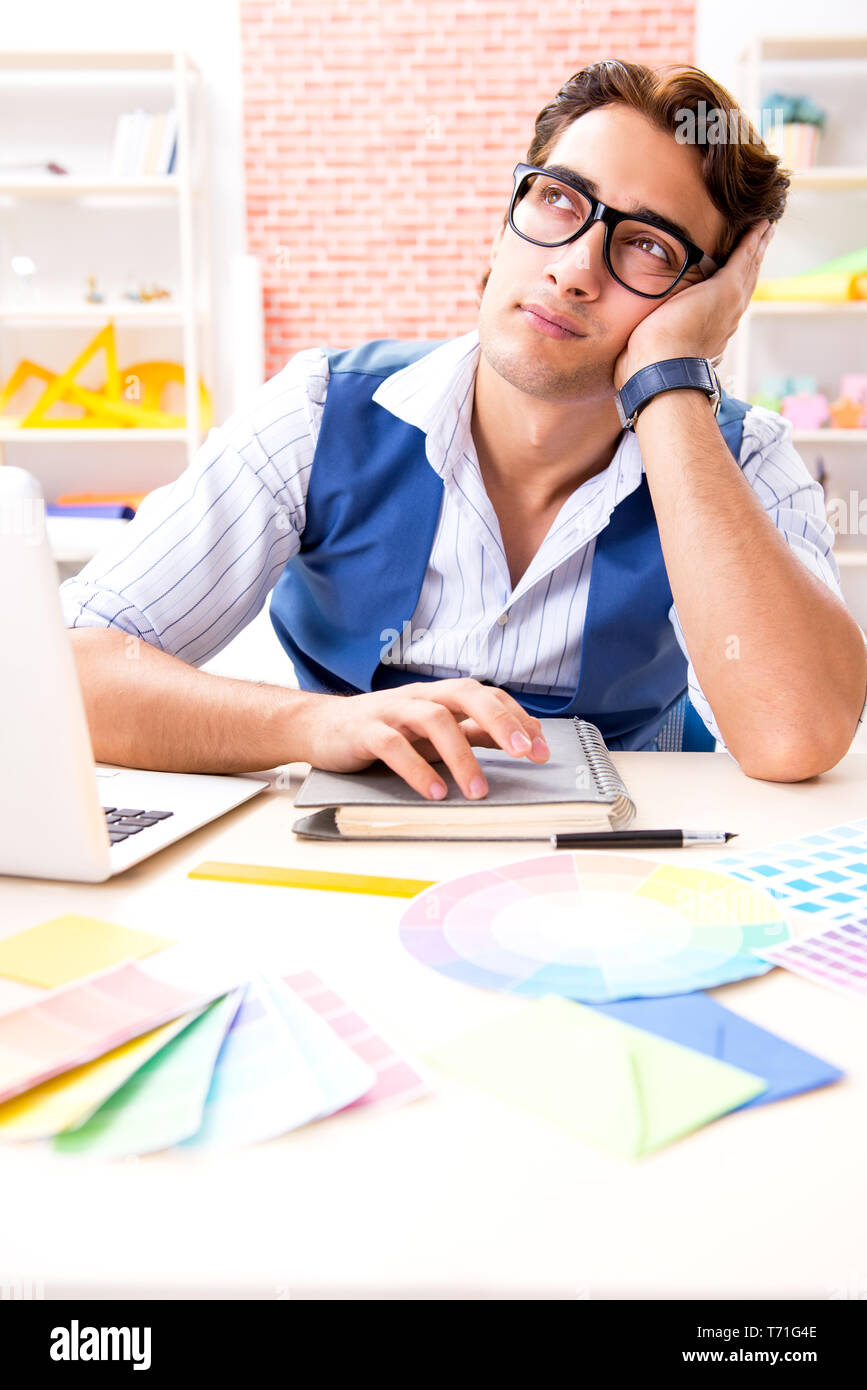 Young designer freelancer working on new project Stock Photo - Alamy