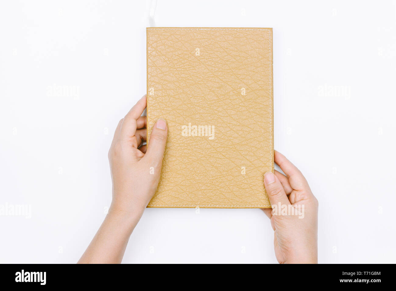 Hands hold the book on white background Stock Photo - Alamy