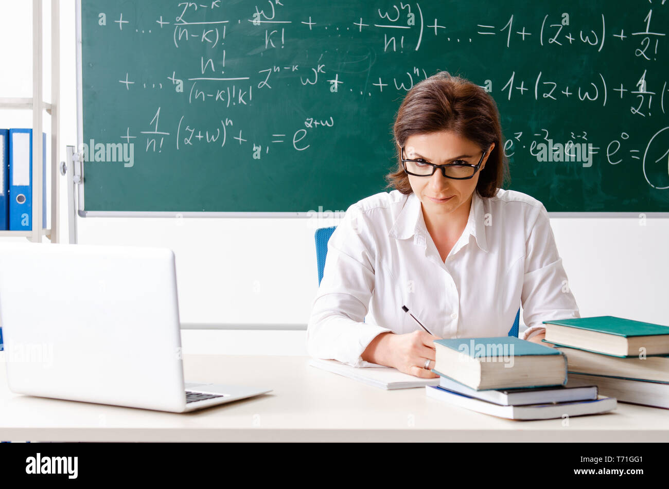 Teacher writing math formulas hi-res stock photography and images - Alamy