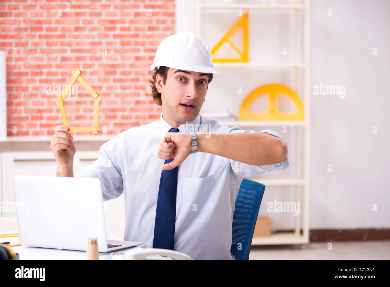 Construction supervisor working on blueprints Stock Photo - Alamy