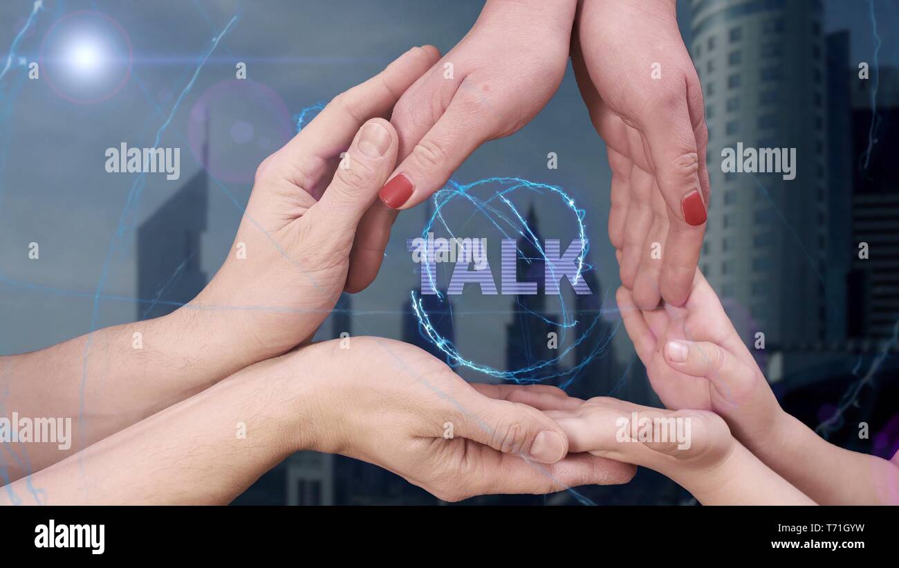 Men's, women's and children's hands show a hologram Talk Stock Photo ...